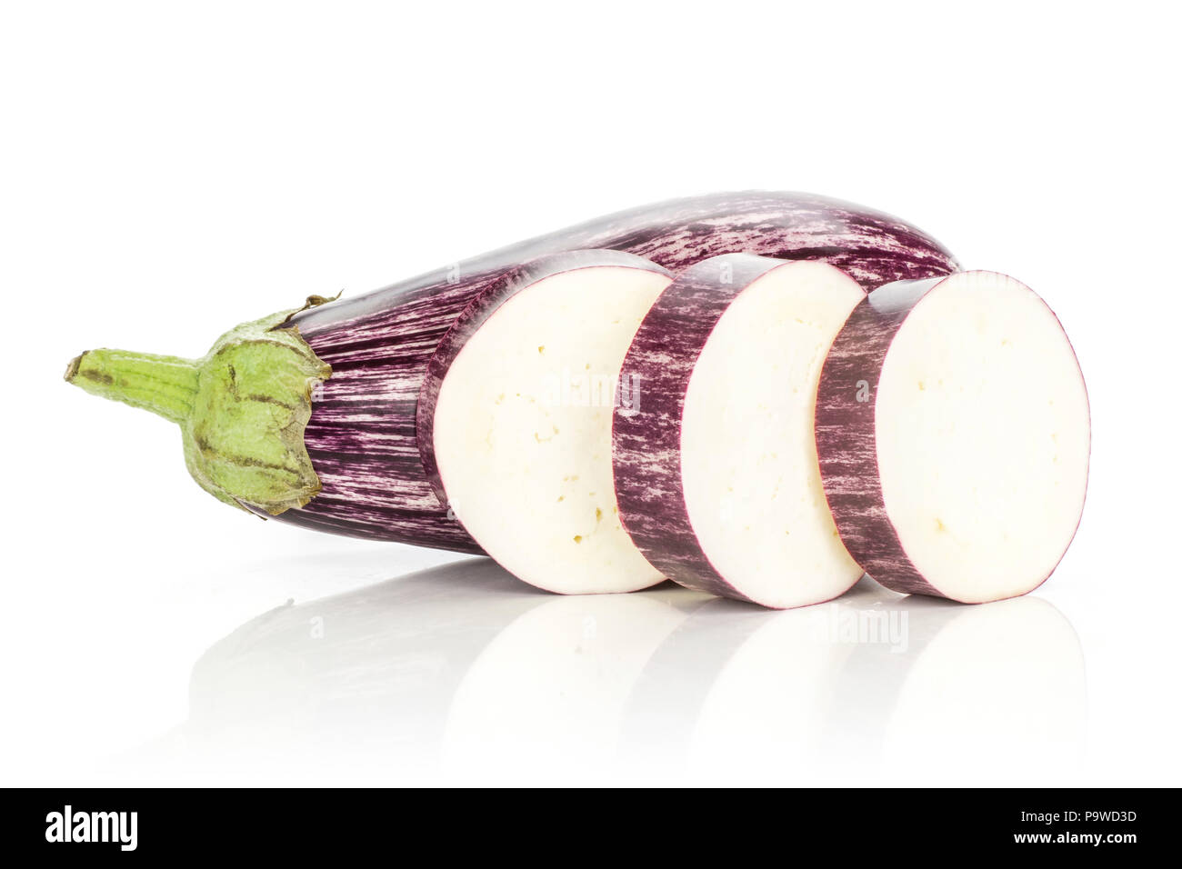 One striped purple eggplant three ring slices isolated on white ...