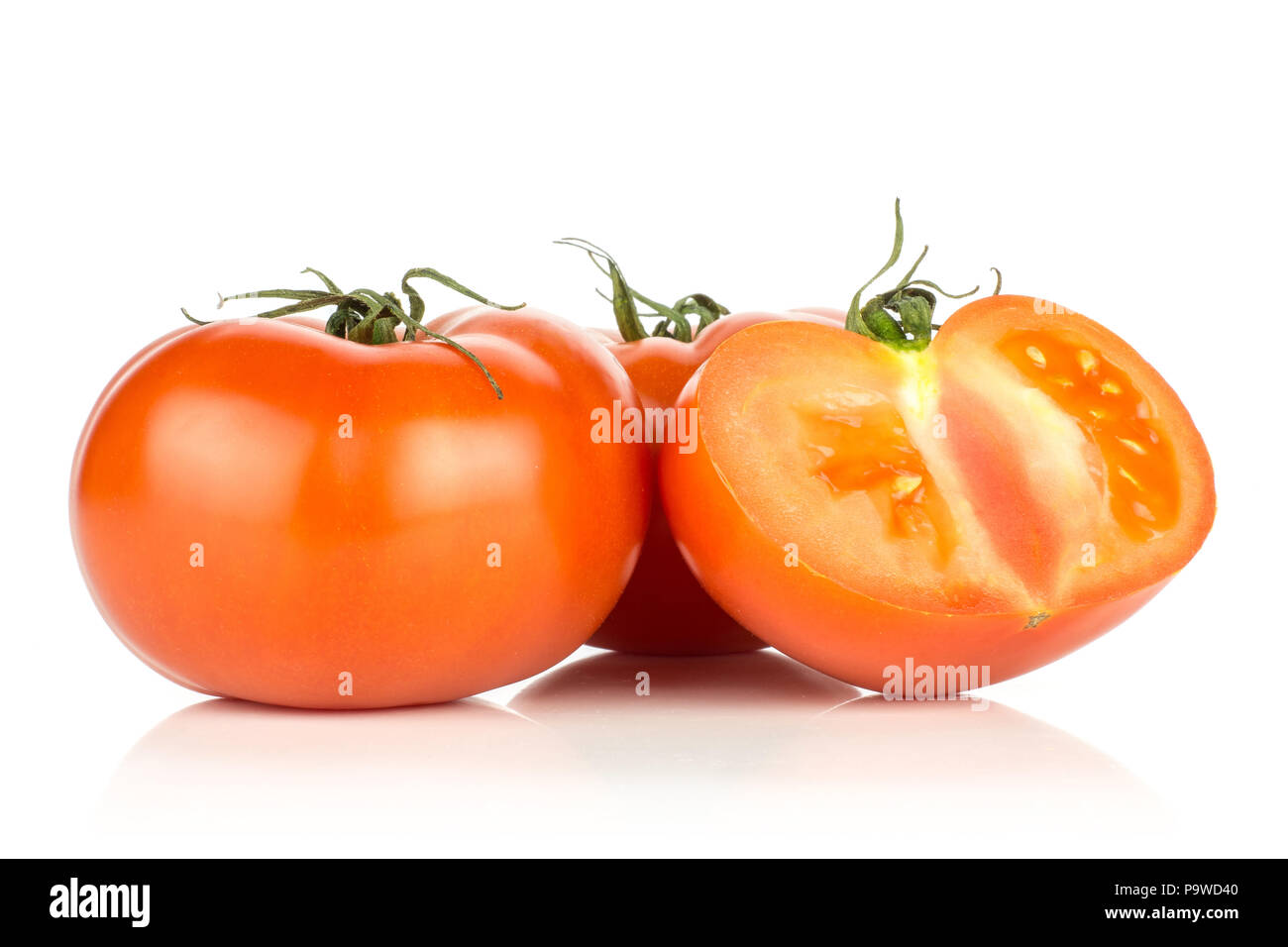 Two red tomato and one half isolated on white background Stock Photo ...