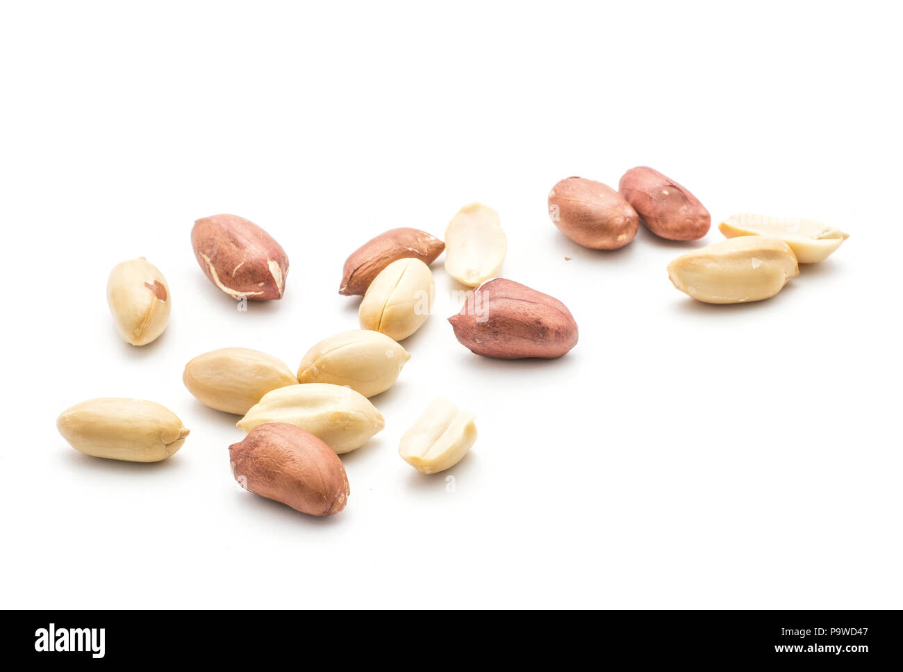 Raw peanuts heap isolated on white background (shelled, husk, whole ...