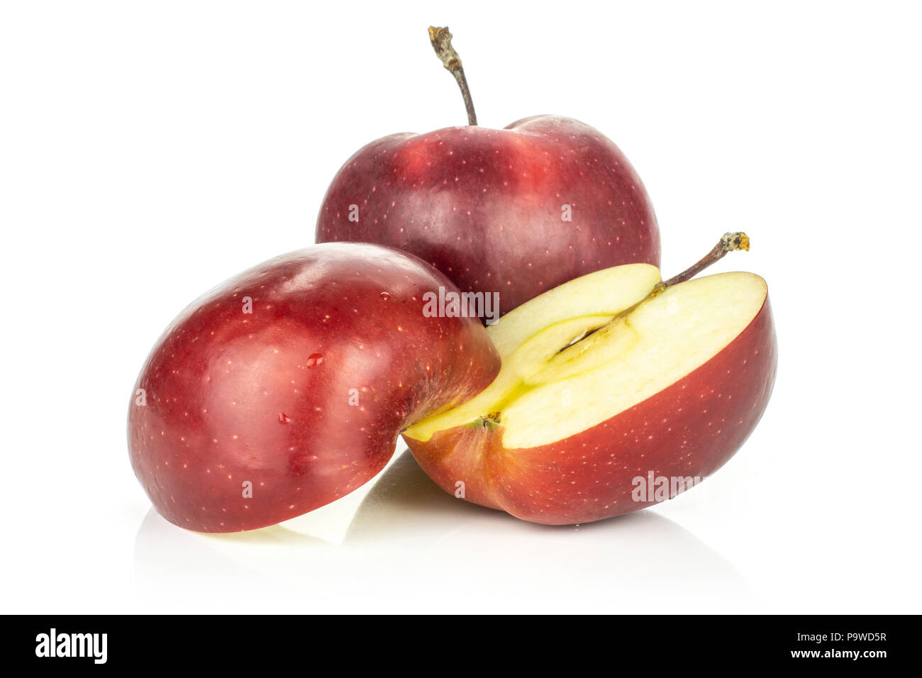 Red delicious apple and sliced one in two halves isolated on white ...