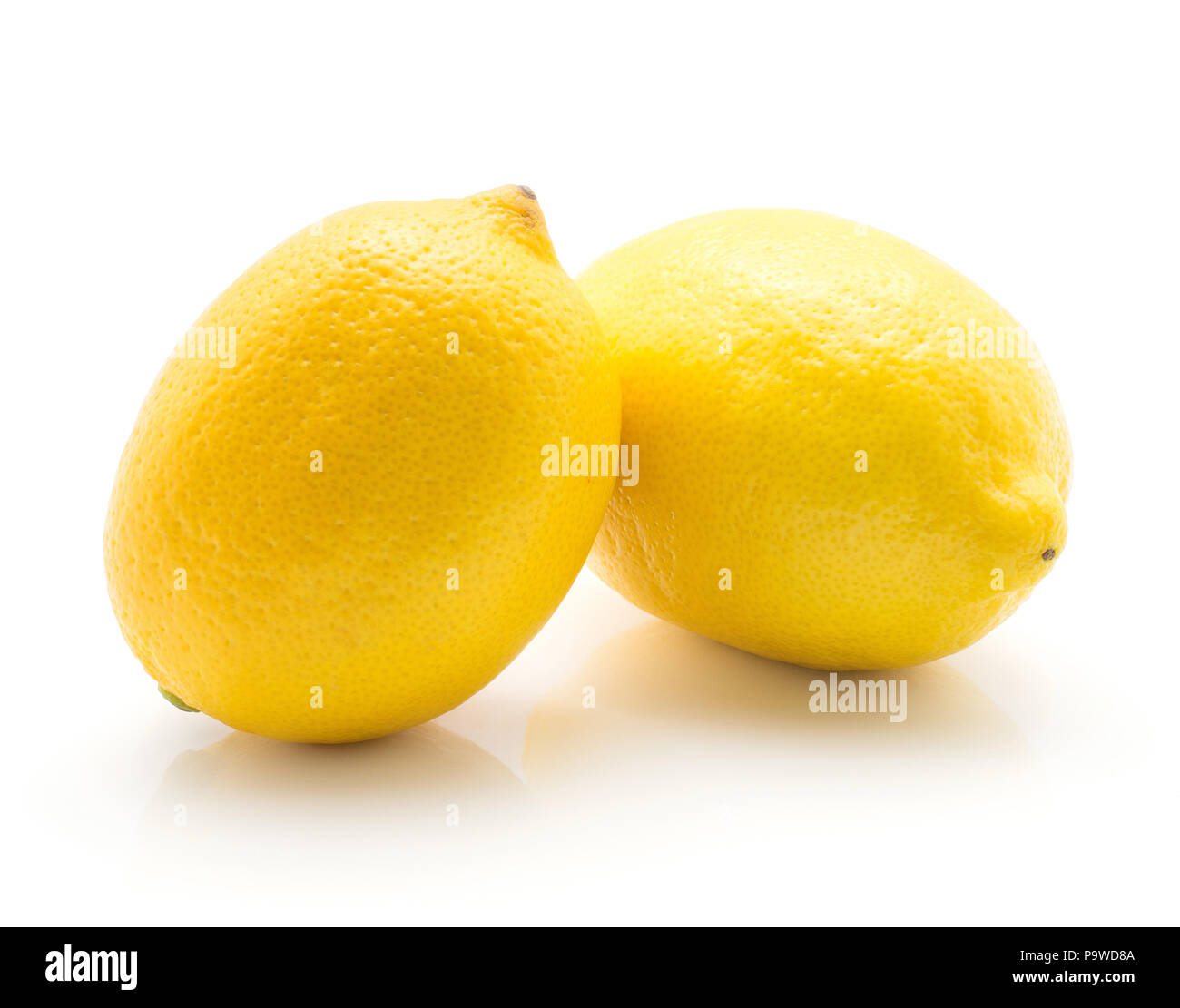 Yellow lemons isolated on white background two whole ripe Stock Photo ...