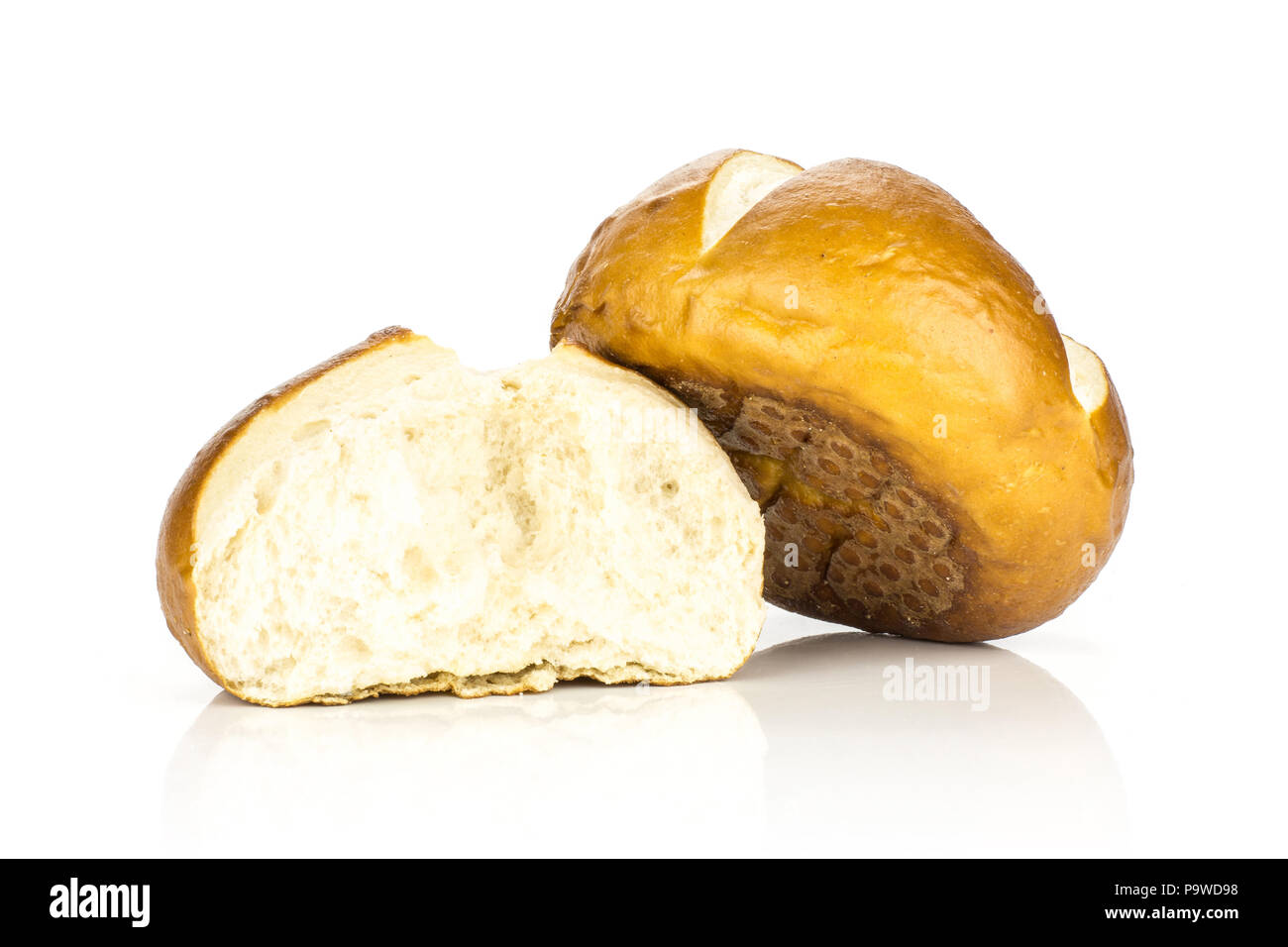 Bavarian bread bun and one cracked isolated on white background fresh ...