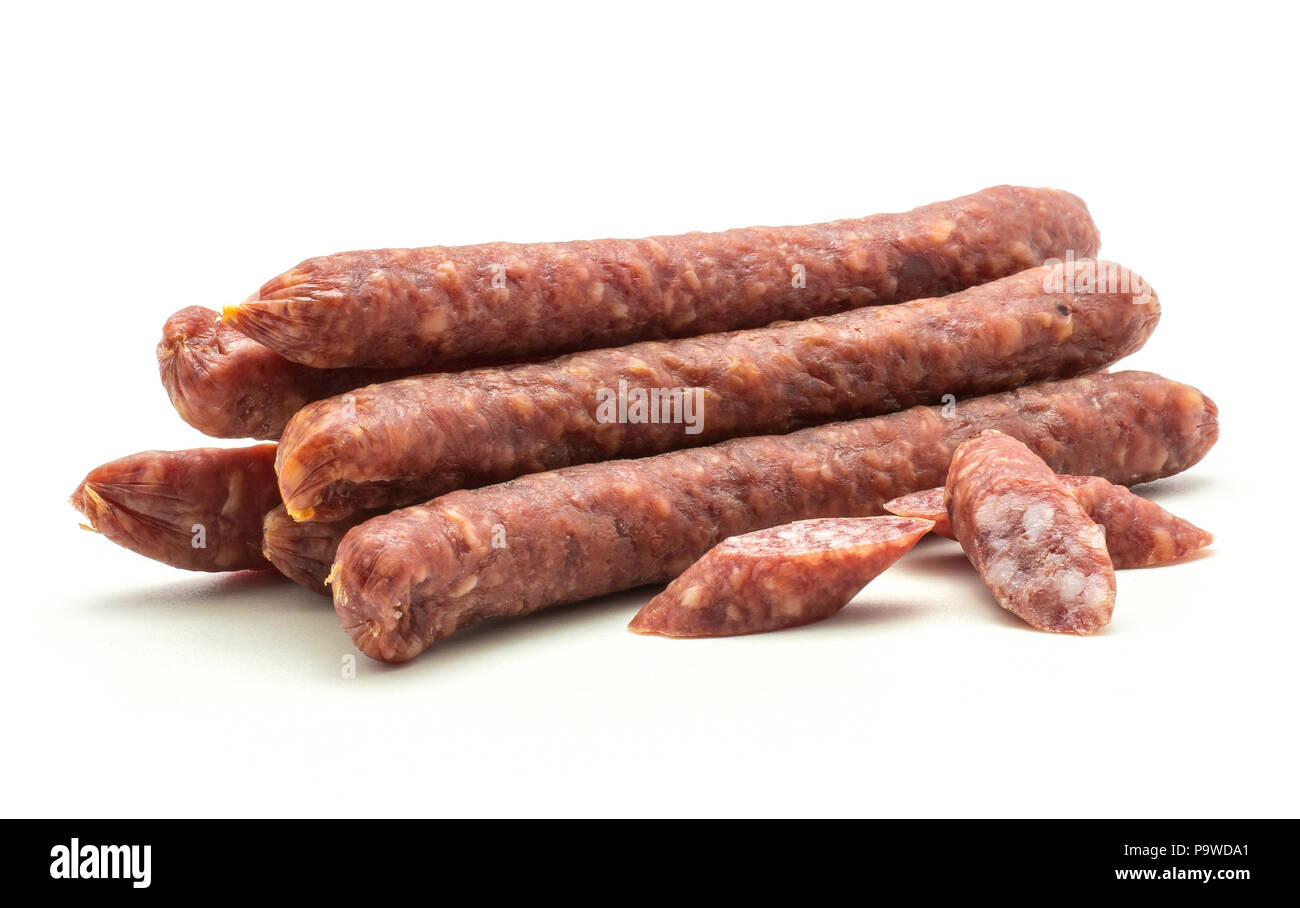 Hungarian dry sausages pepperoni with three cut pieces isolated on ...