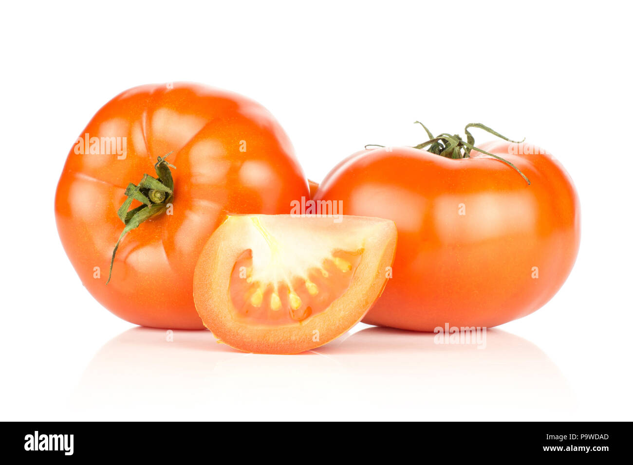 Two red tomatoes and one slice isolated on white background fresh Stock ...