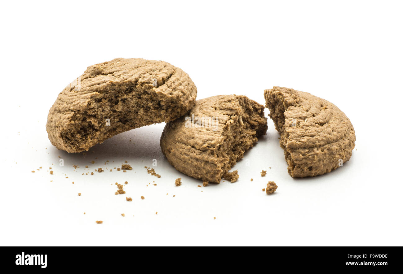 Cracked cocoa oat cookies isolated on white background drop shape brown ...