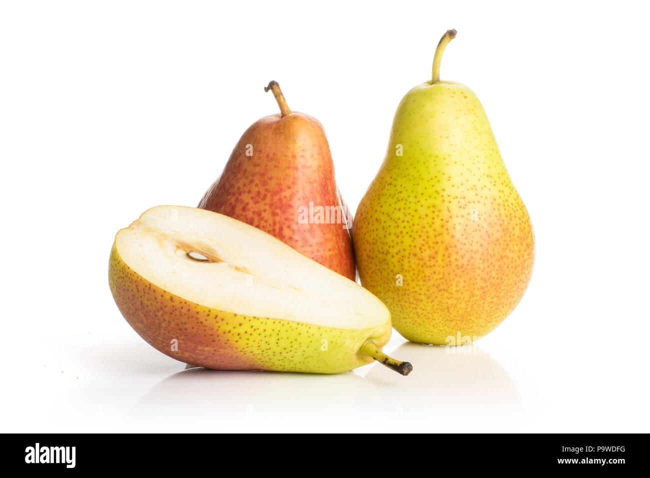Group of two whole one half of fresh red pear forelle variety isolated ...