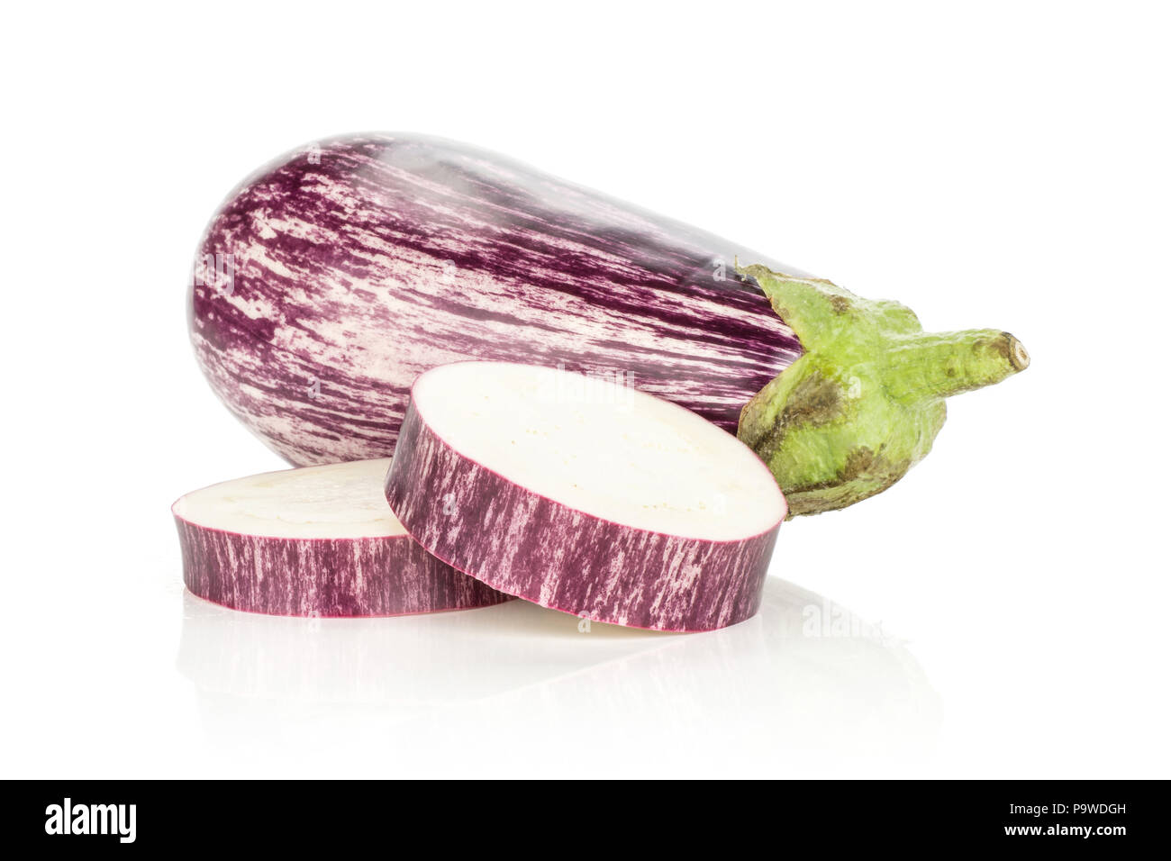 One striped purple eggplant and two sliced rings isolated on white ...