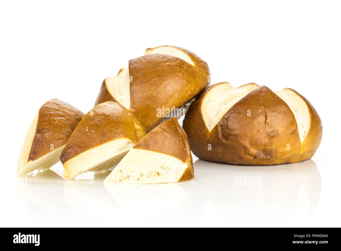 Two Bavarian bread buns and three slices isolated on white background ...