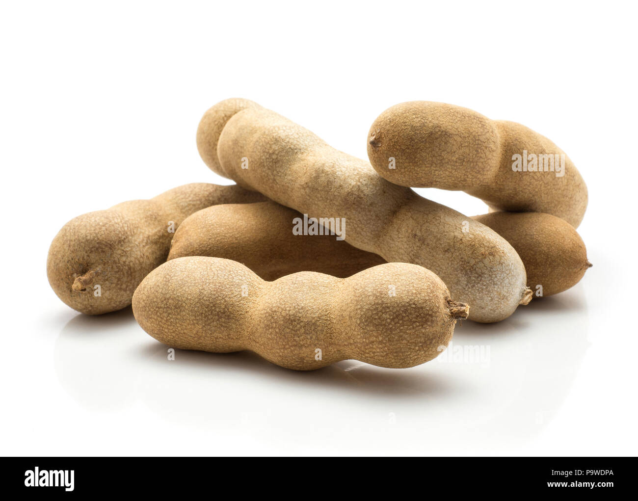 Brown tamarind stack isolated on white background Indian dates in a ...
