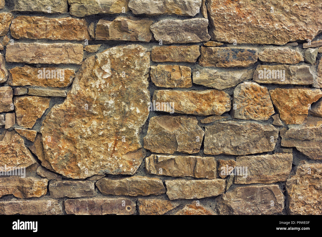 background texture of wall made of stone, tinted photo Stock Photo - Alamy