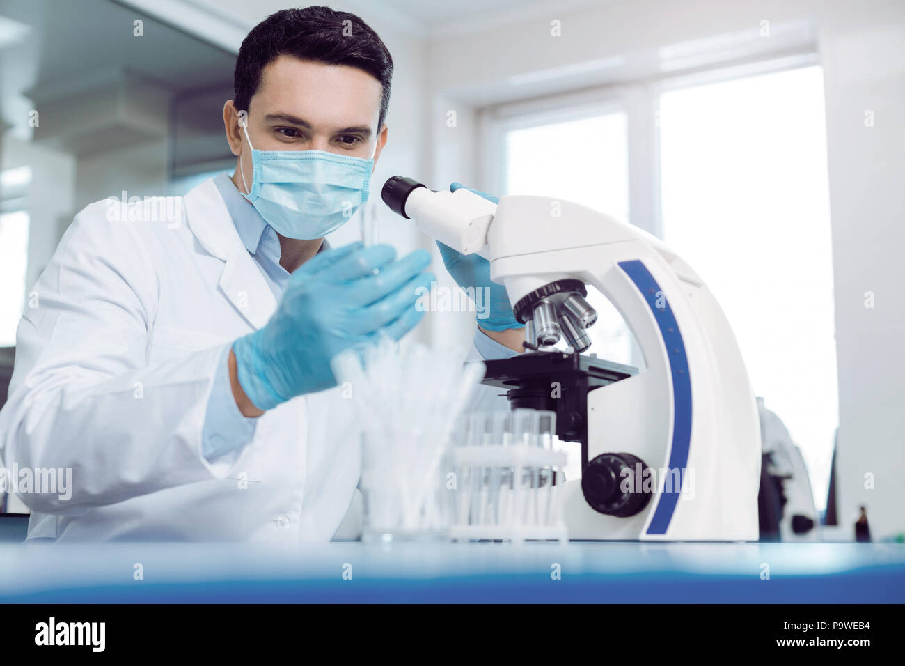 Modern research. Professional smart male scientist wearing uniform and ...