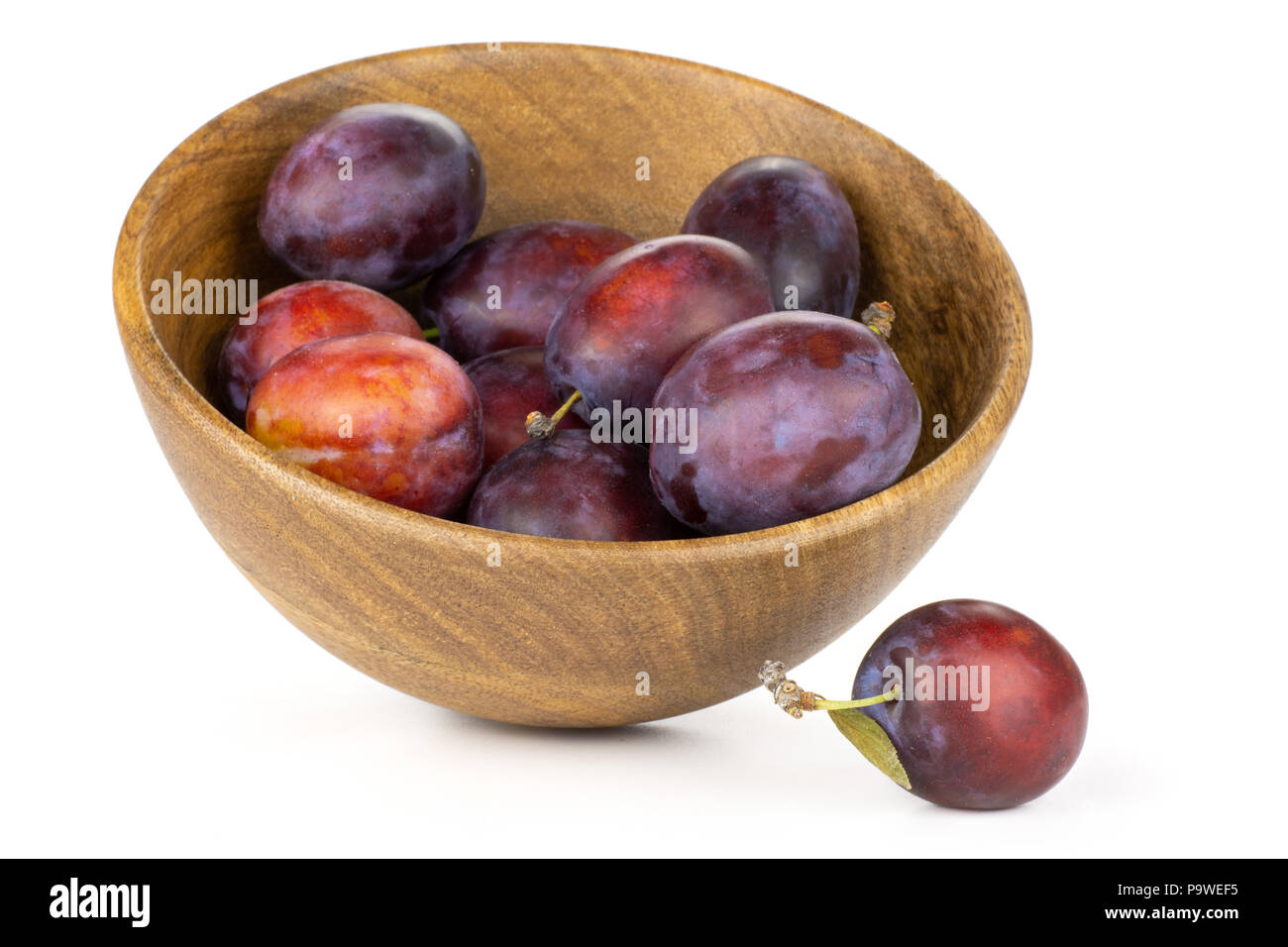 Lot of whole fresh violet-blue plum vibrant moyer variety in a wooden ...