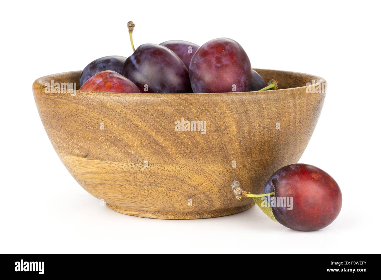 Lot of whole fresh violet-blue plum vibrant moyer variety in a wooden ...