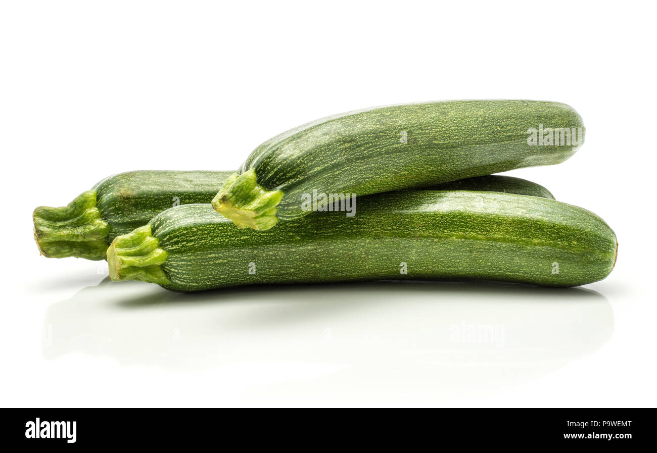 Green zucchini three long raw courgette isolated on white background ...