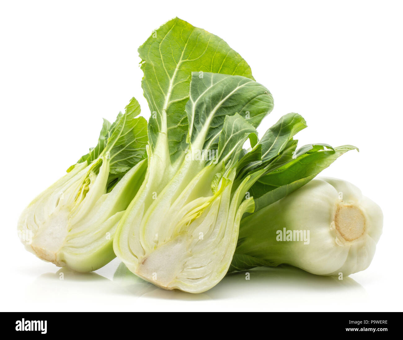 Bok choy (Pak choi) one cabbage and two sliced halves isolated on white ...