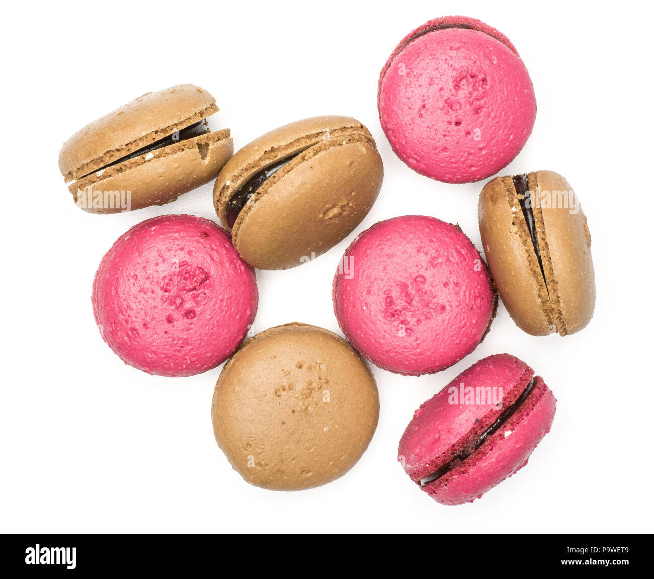 French macarons (brown chocolate and pink raspberry) top view isolated ...