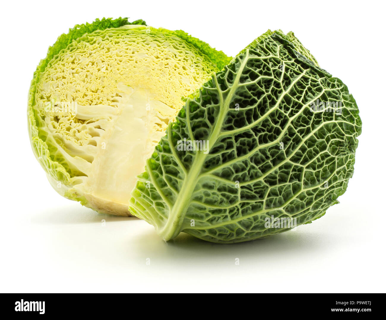 Savoy cabbage cut in half isolated on white background fresh green two ...