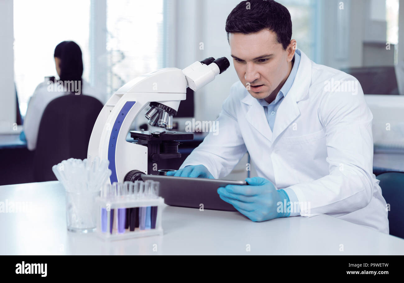 Nice intelligent man holding hi-res stock photography and images - Alamy