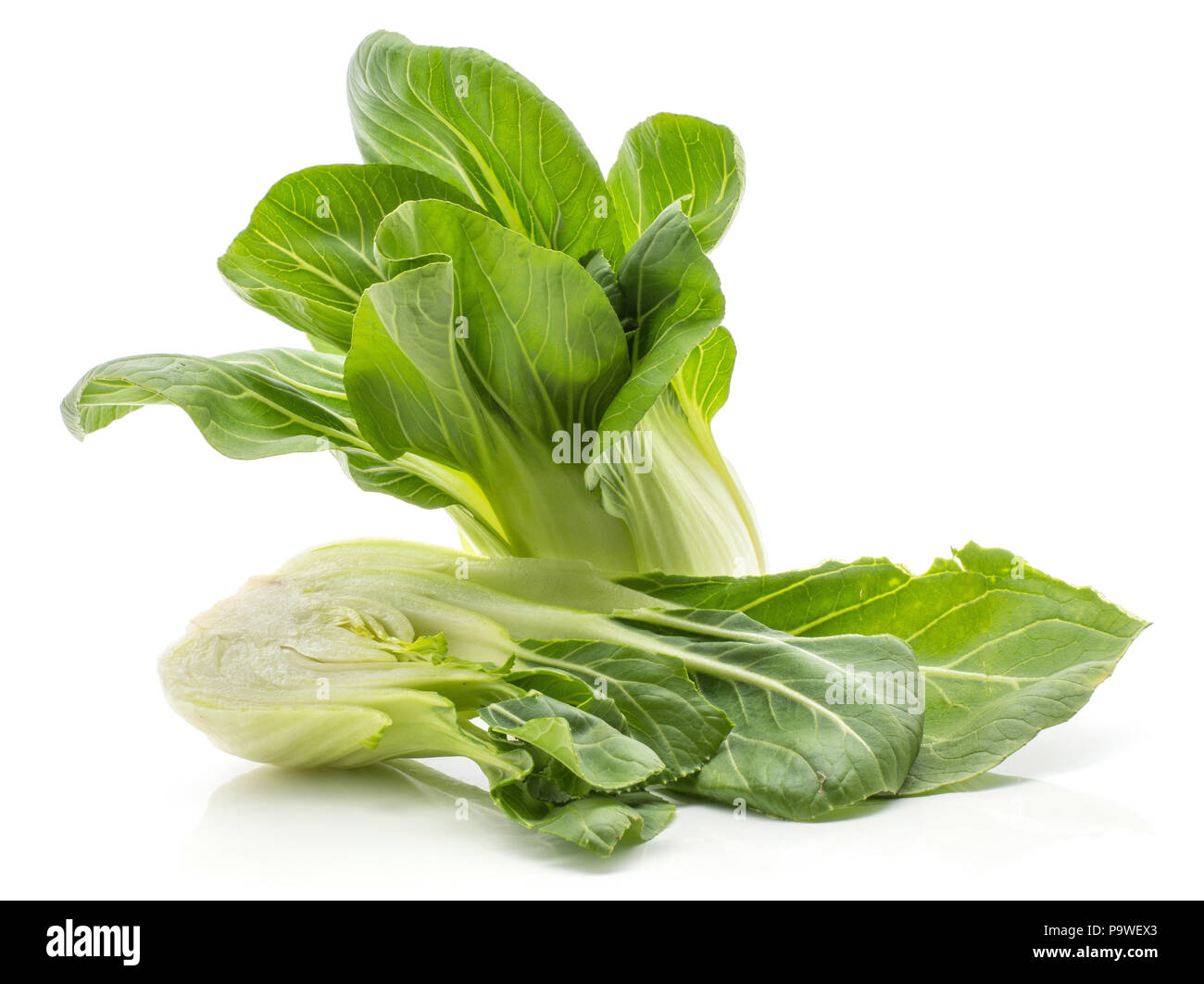 Sliced bok choy (Pak choi) stack isolated on white background two fresh ...