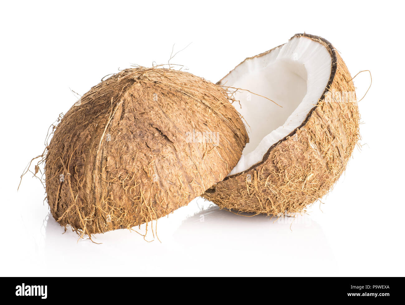 One sliced coconut two halves isolated on white background brown ...