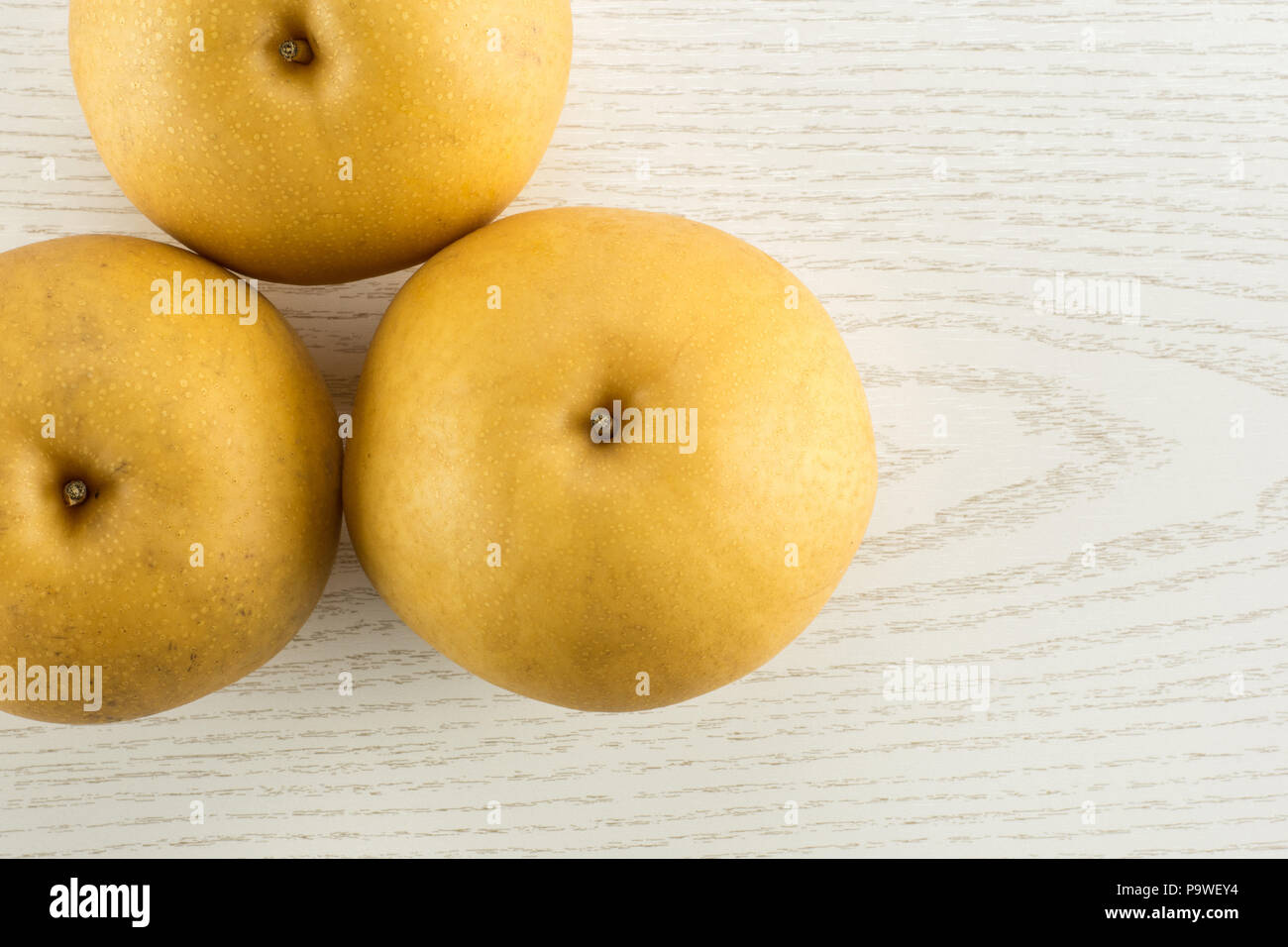 Chinese golden pears top view Nashi variety isolated on white wooden ...