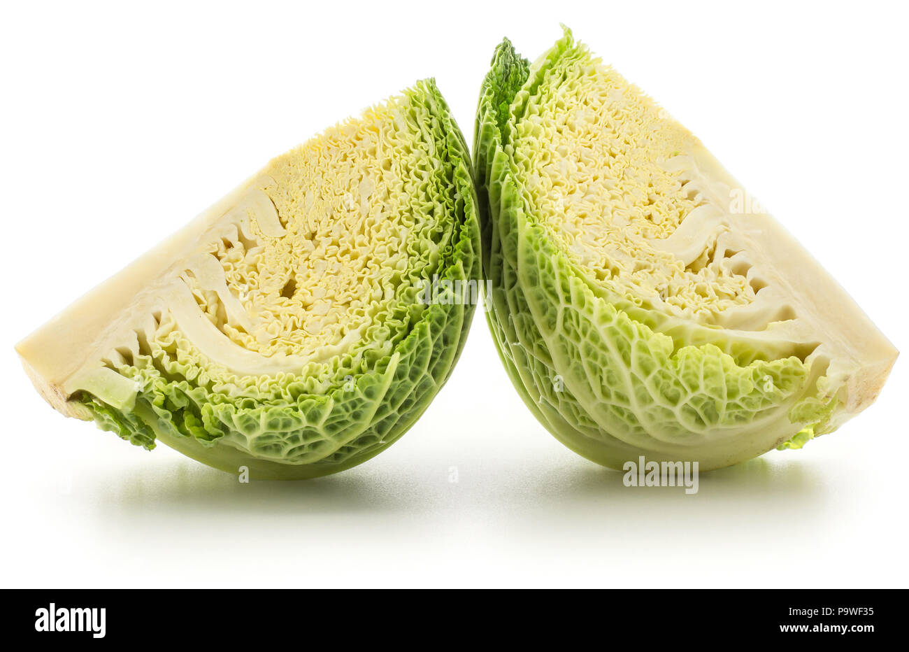 Two savoy cabbage quarter slices isolated on white background fresh cut ...