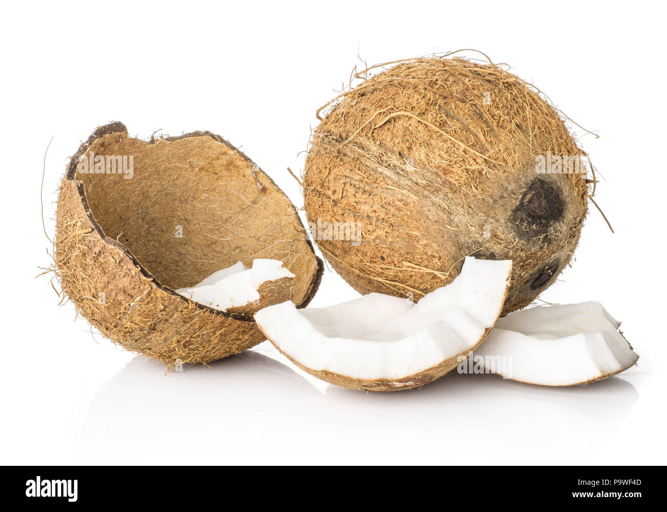 Coconut set one nut with a half and two pieces isolated on white ...