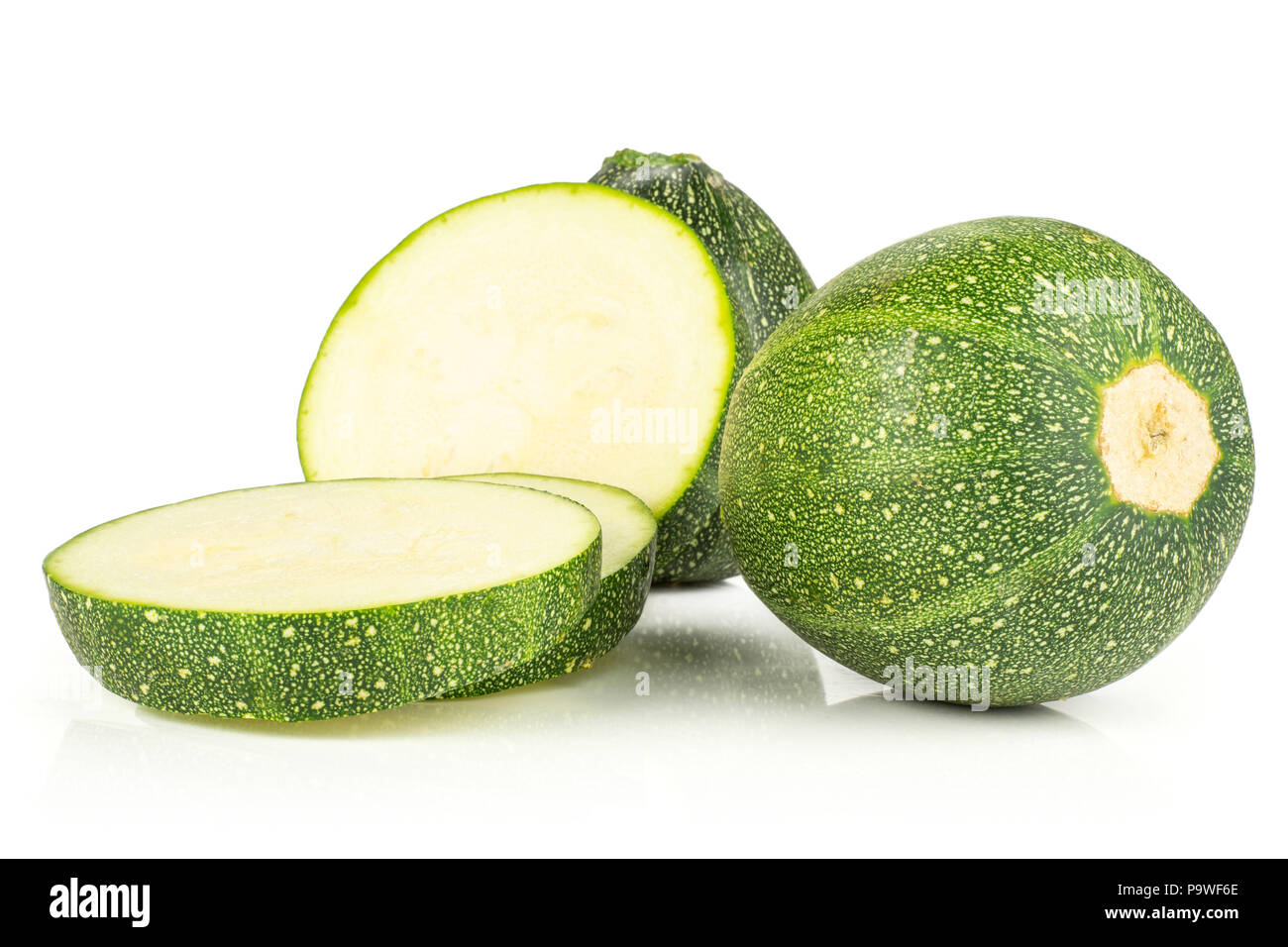 Round zucchini set one whole and several slices isolated on white ...