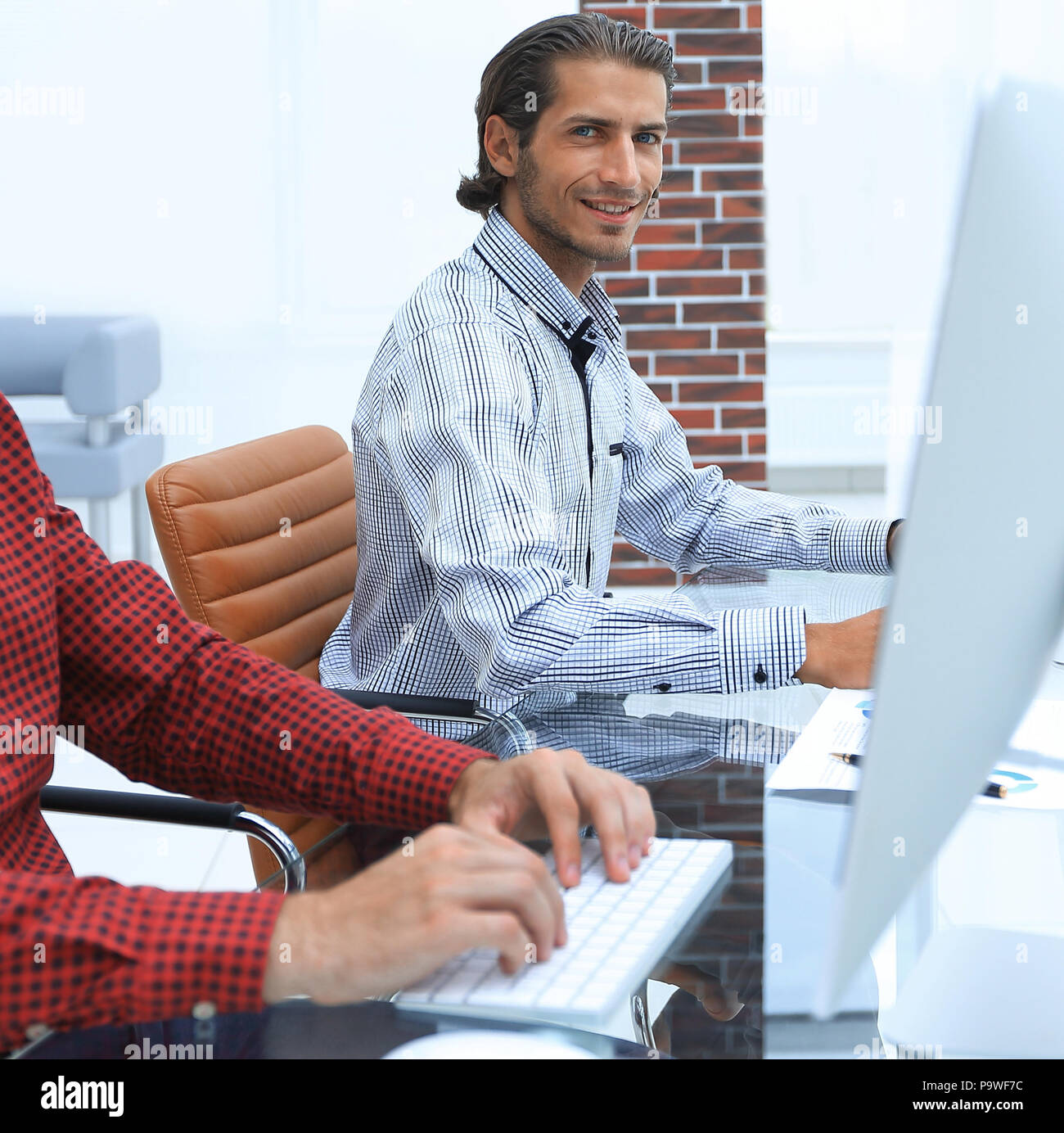 two employees work in the office Stock Photo - Alamy