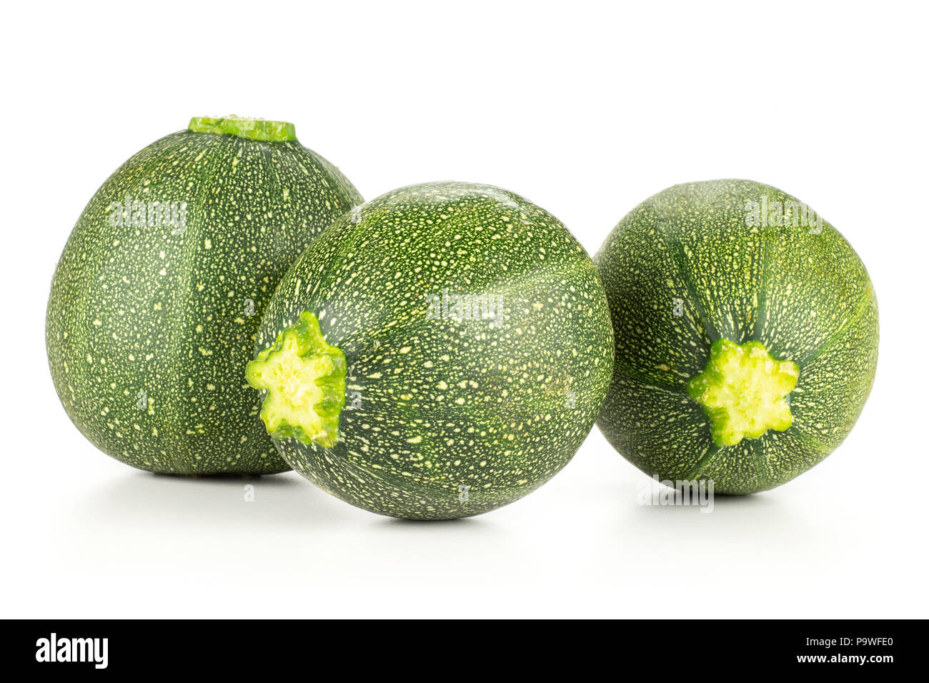 Round zucchini three fresh summer squash isolated on white background ...