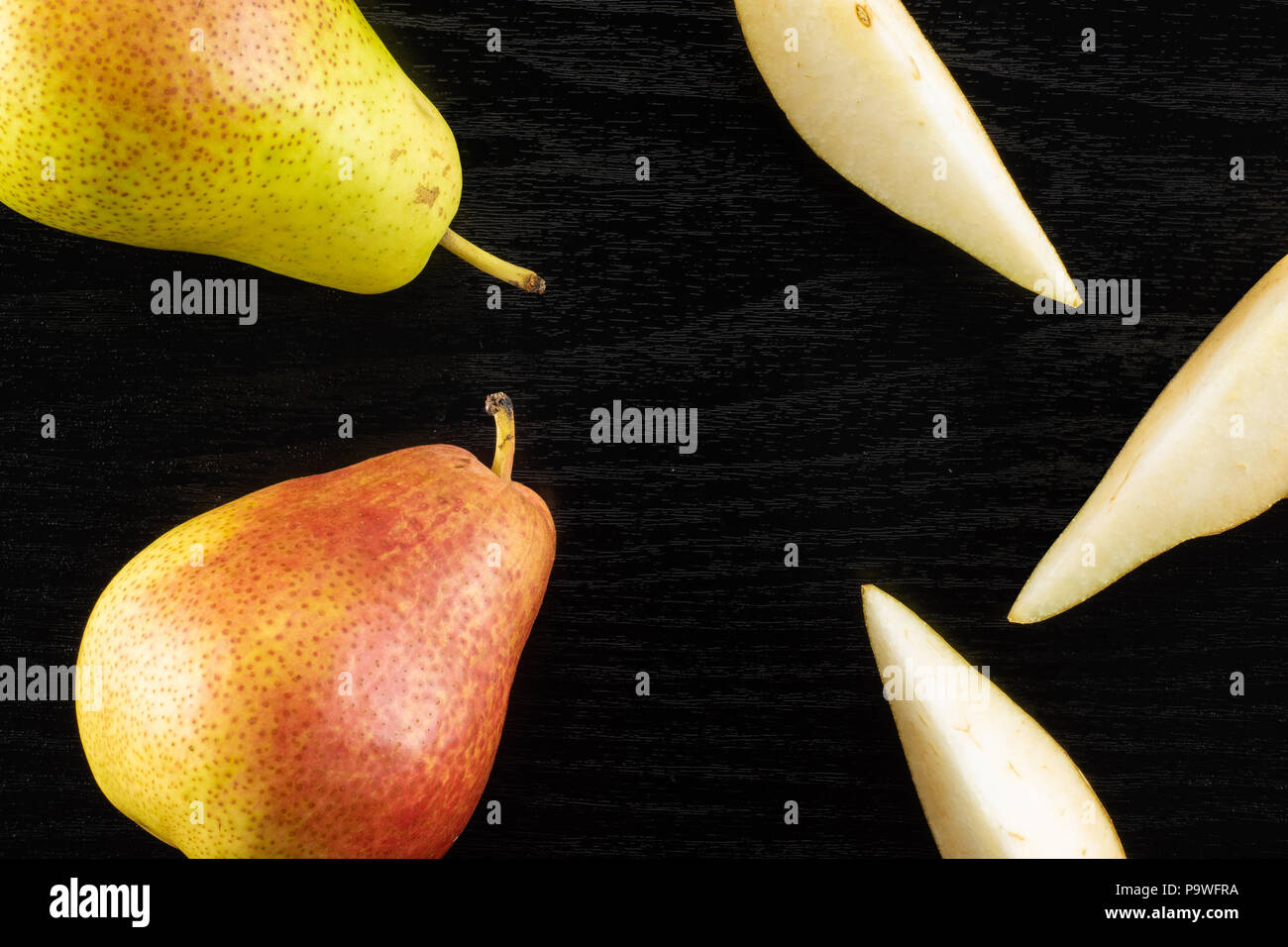 Group of two whole three slices of fresh red pear forelle variety ...