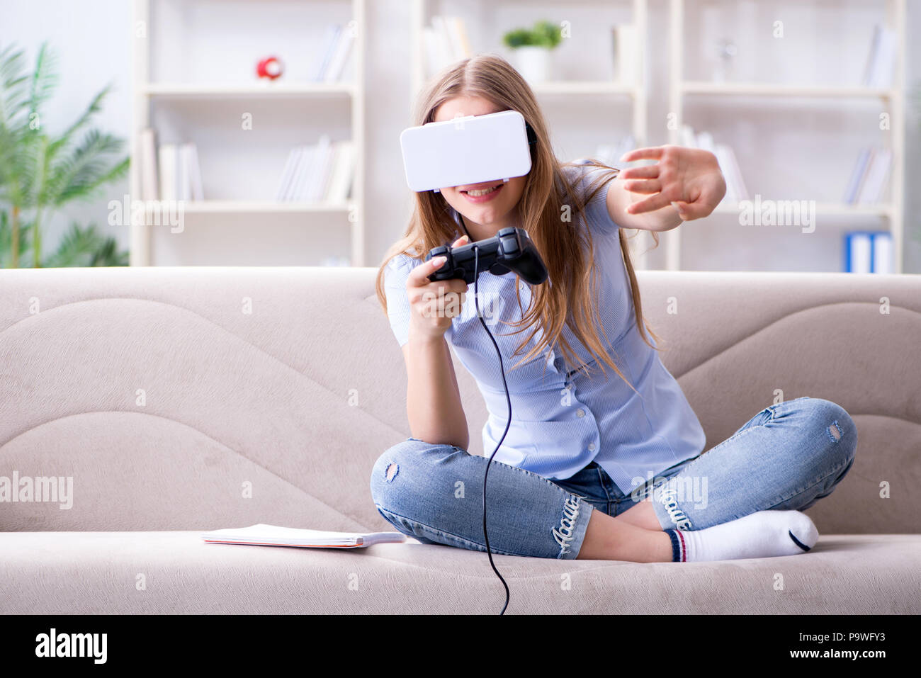 Young girl playing virtual reality games Stock Photo - Alamy
