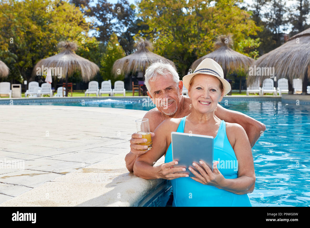 Using computer in swimming pool hi-res stock photography and images - Alamy