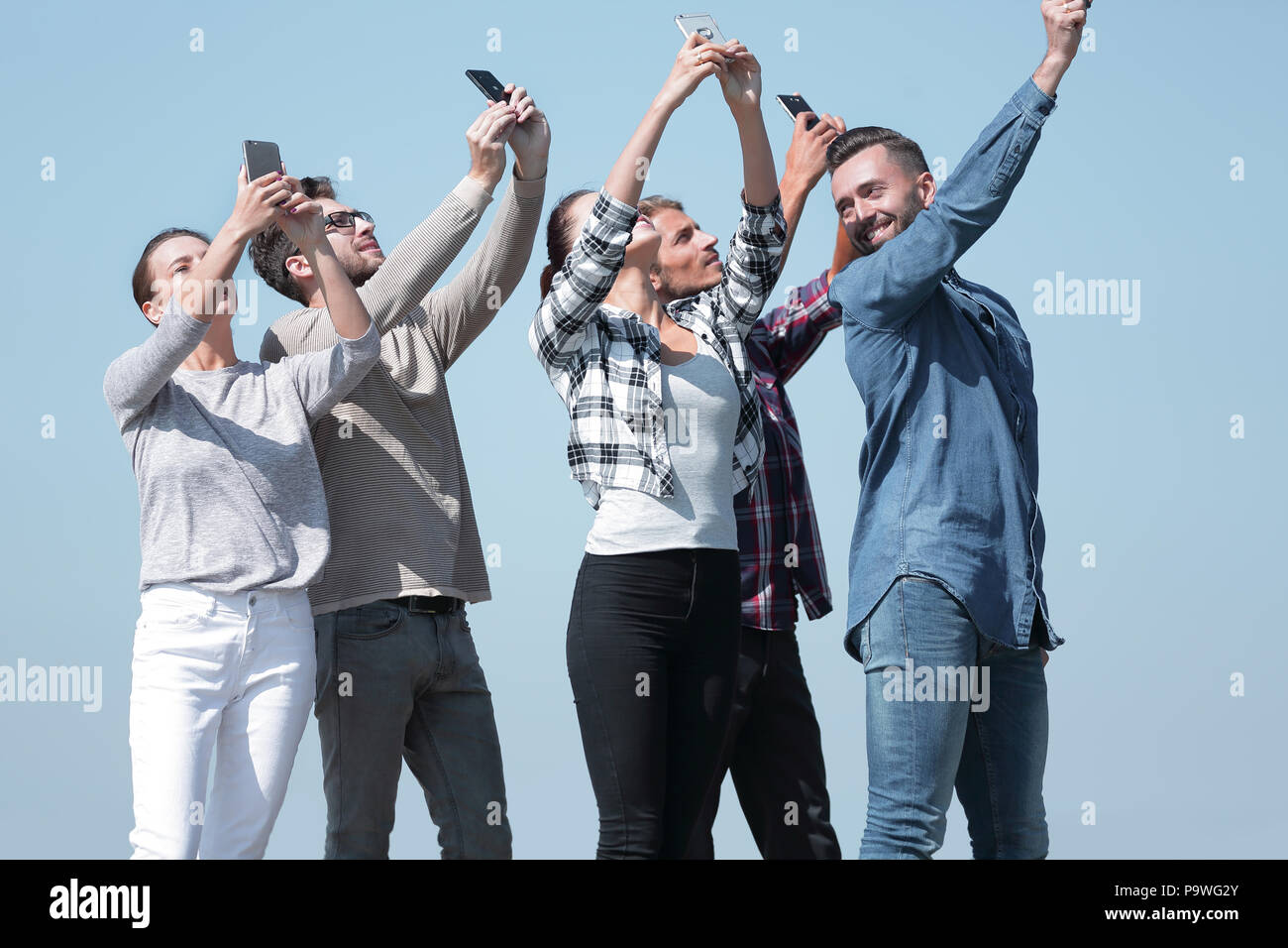 group of young people with smartphones Stock Photo - Alamy