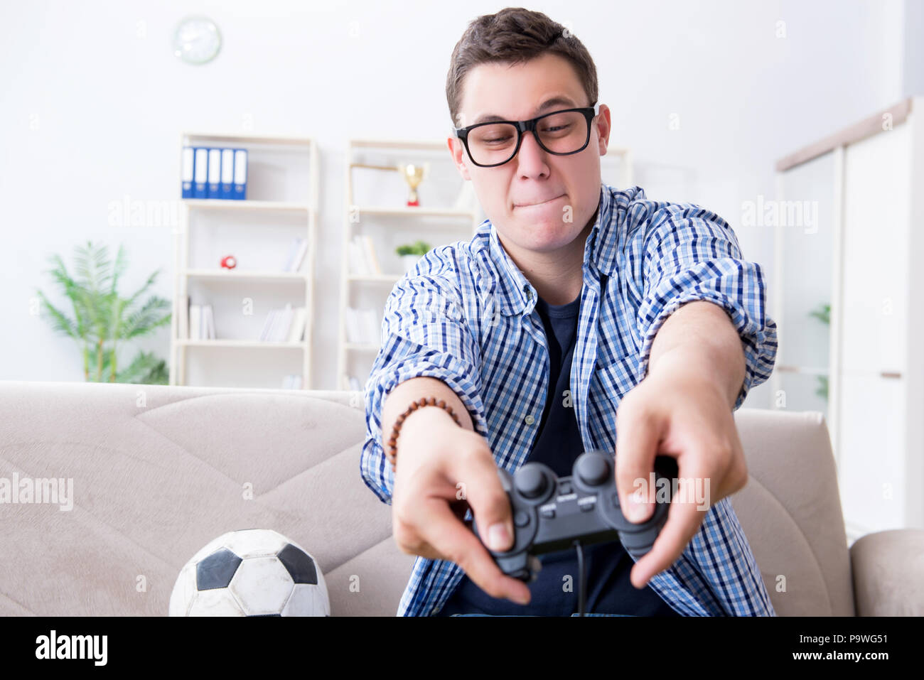 Addicted excited young man playing hi-res stock photography and images ...