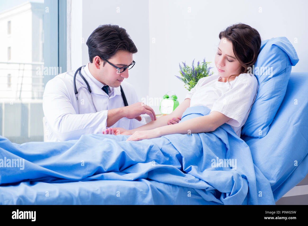 Doctor doing medical injection in hospital room Stock Photo - Alamy