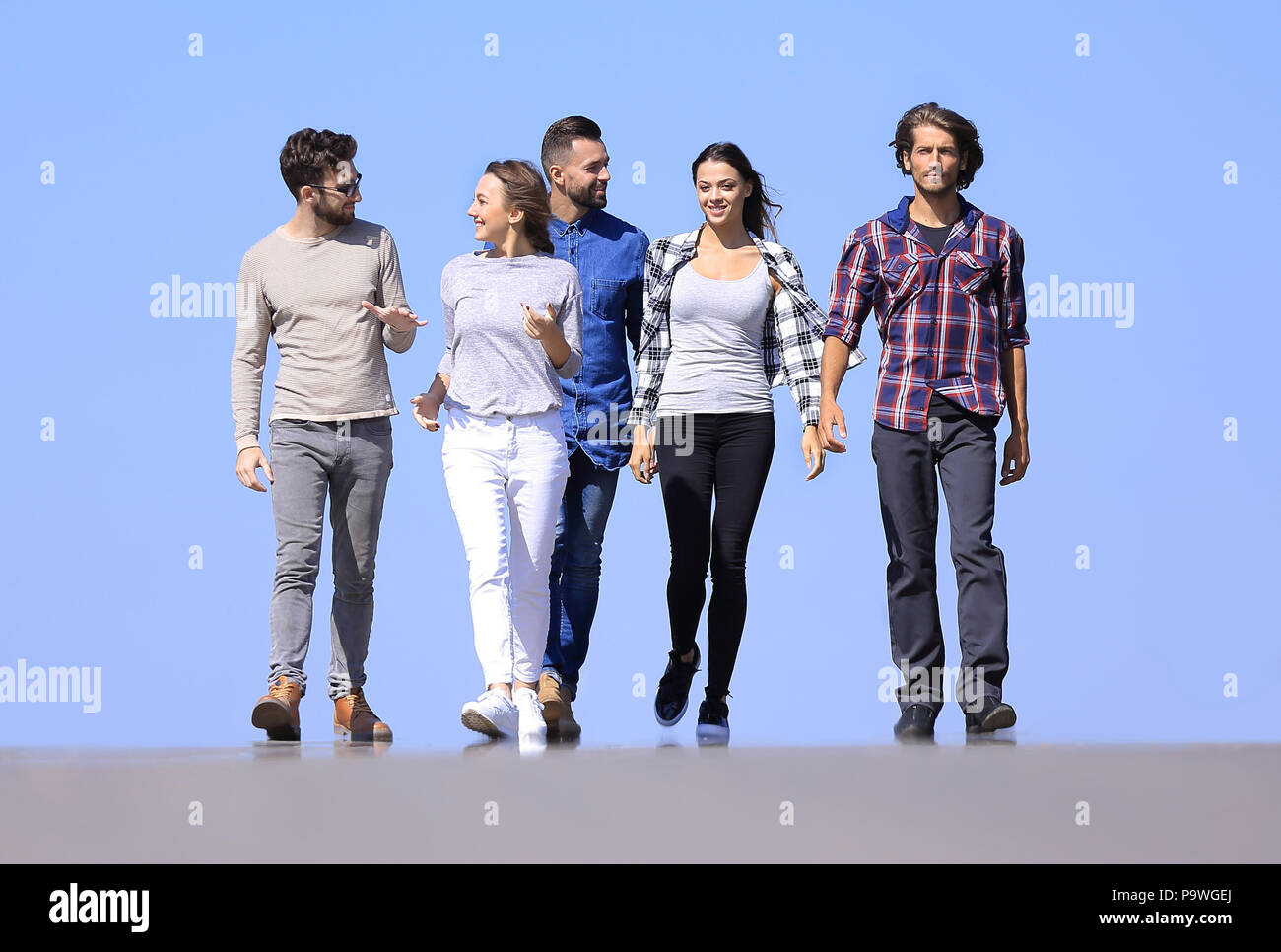team of friends, walks on the road Stock Photo - Alamy
