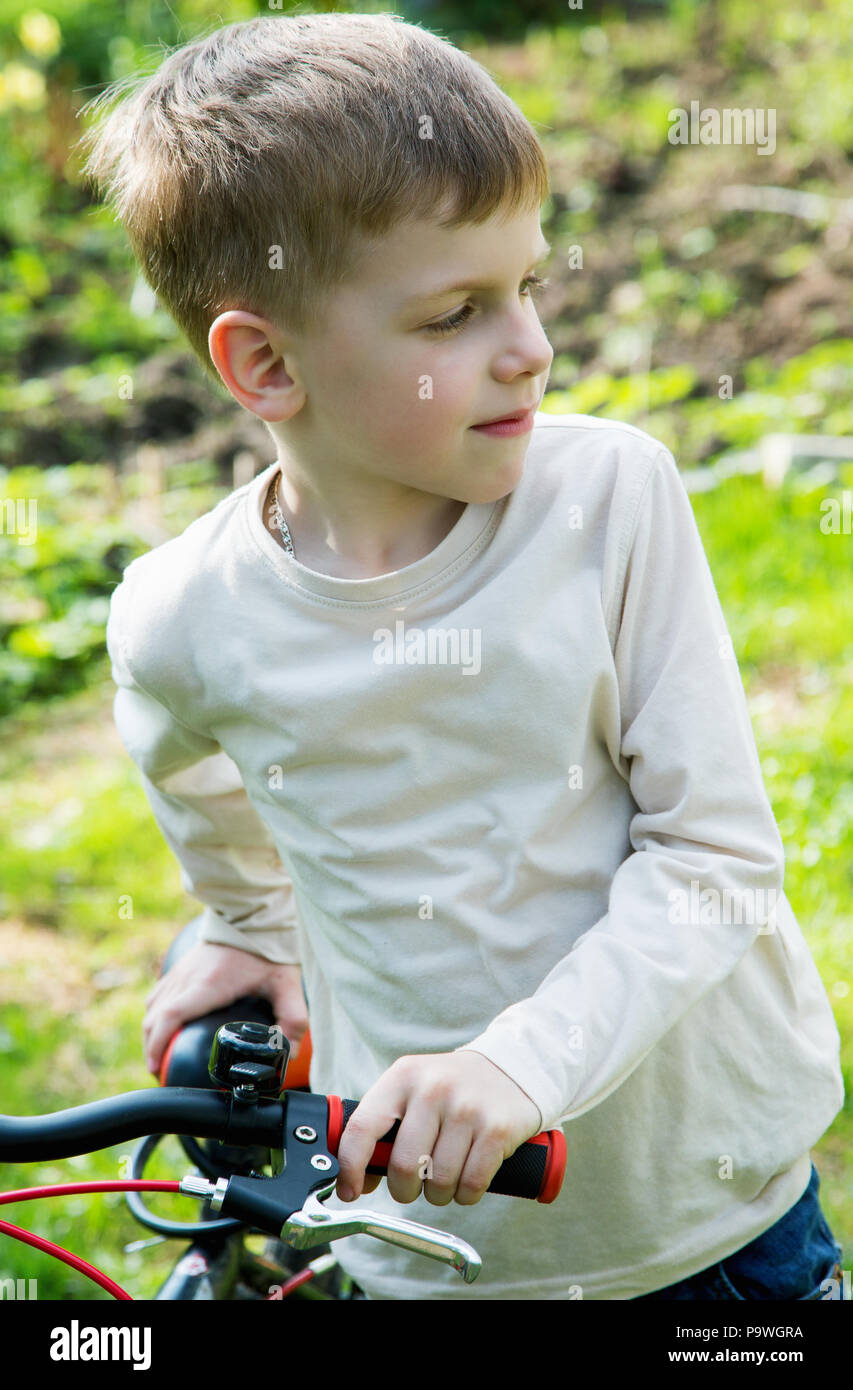 Boy next to his bicycle hi-res stock photography and images - Alamy