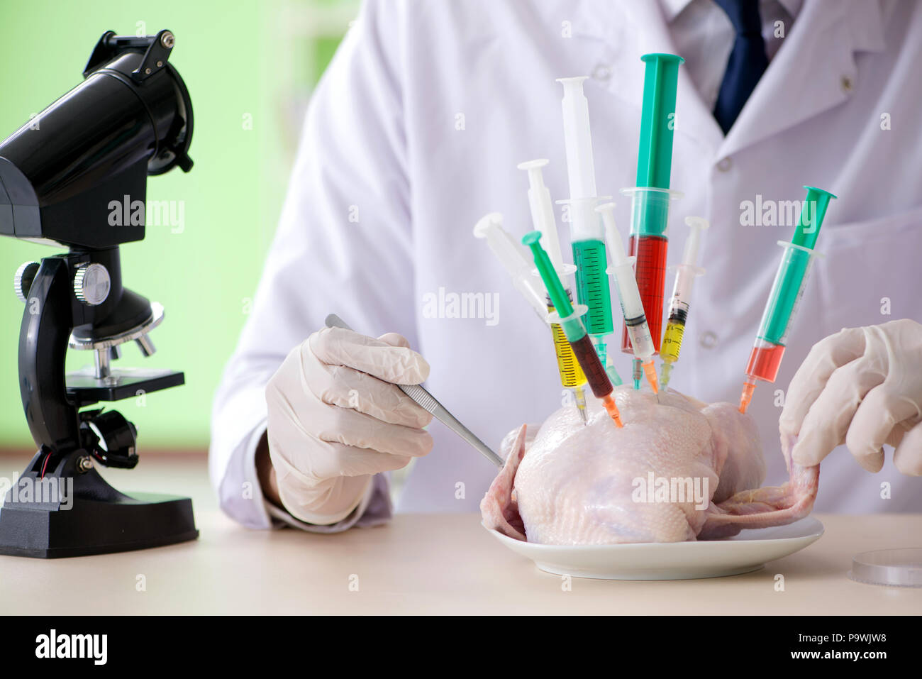 Lab assistant testing GMO chicken Stock Photo - Alamy