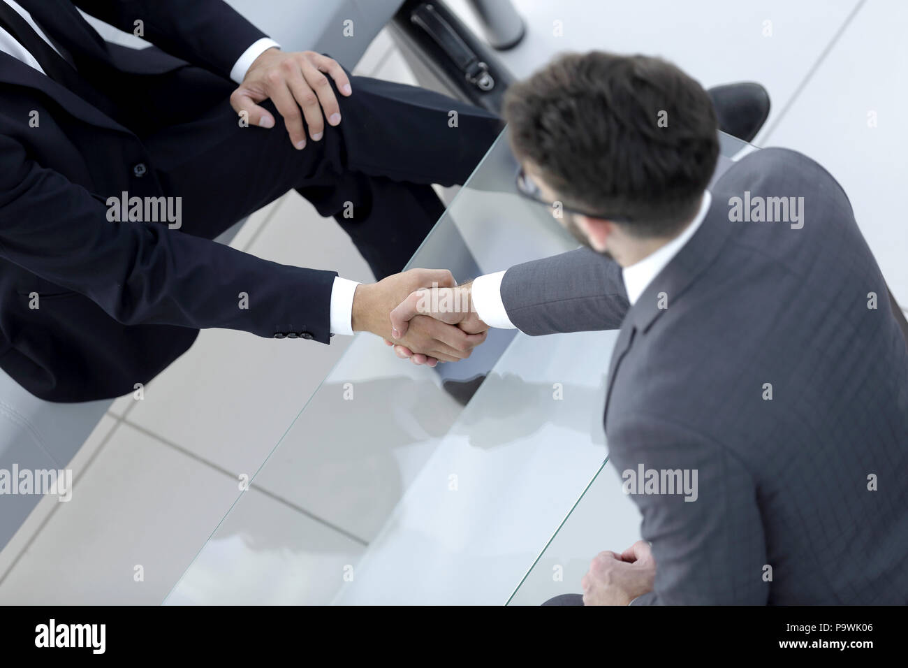 handshake Manager and the client in the office Stock Photo - Alamy