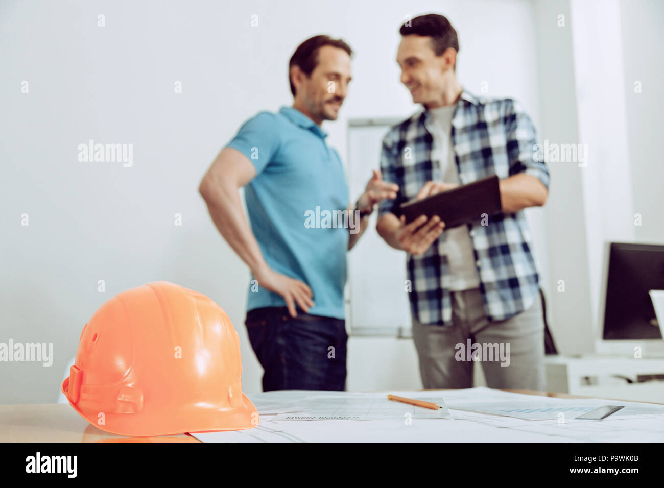 Important talk. Serious qualified responsible engineers standing in ...