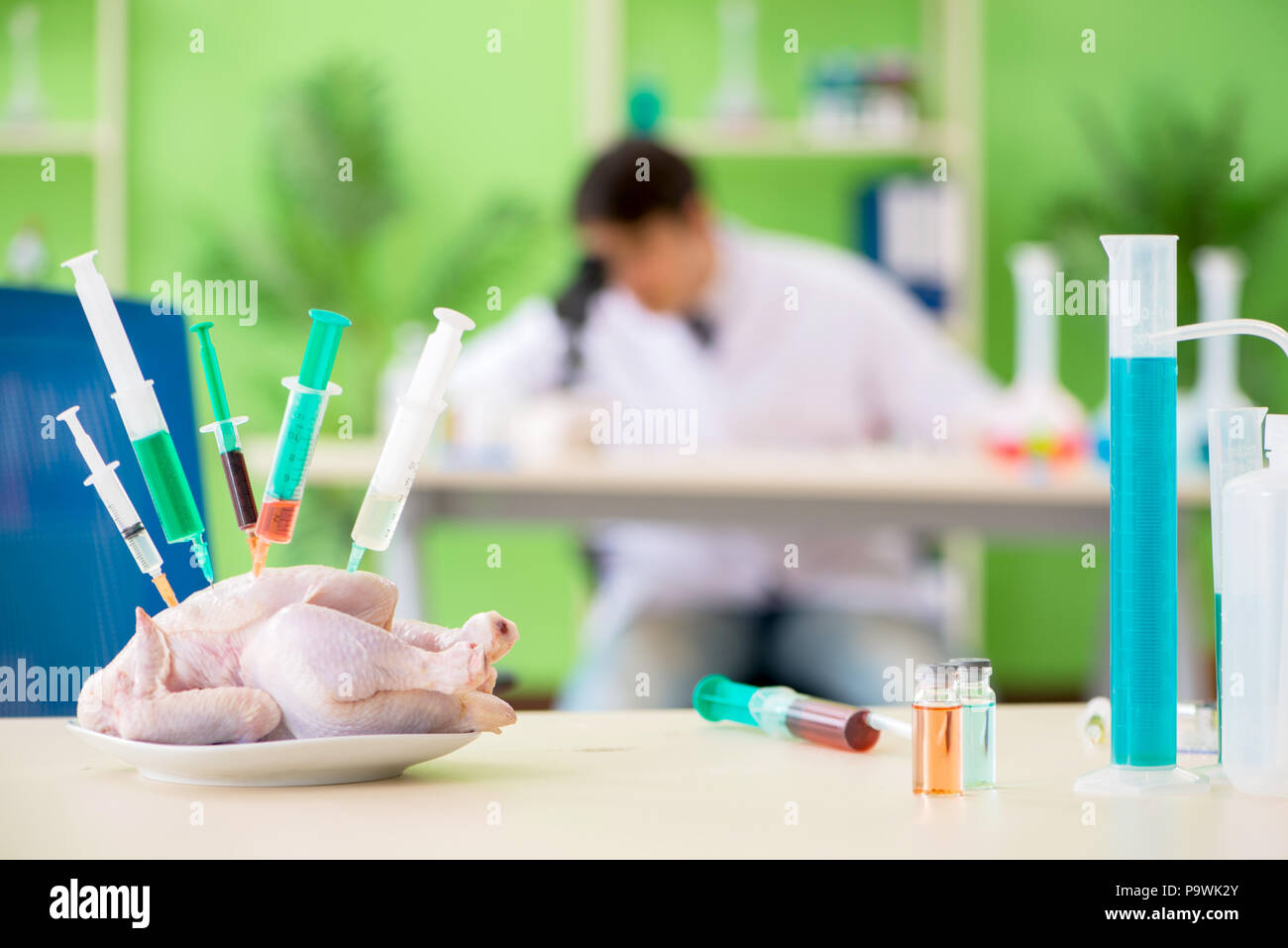 Lab assistant testing GMO chicken Stock Photo - Alamy
