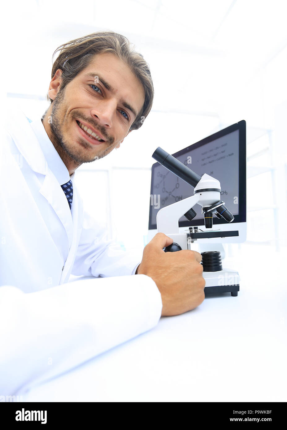 Student in biology using microscope in training class Stock Photo - Alamy