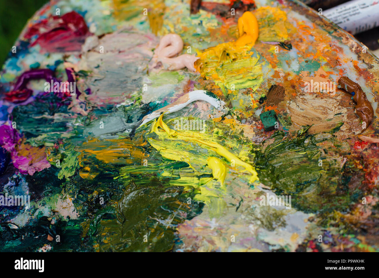 Palette with oil paints. Close up of different color oil paint Stock ...