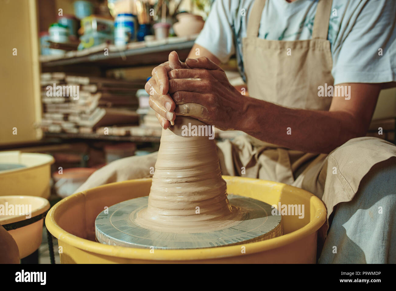 Creating a jar or vase of white clay close-up. Master crock Stock Photo ...