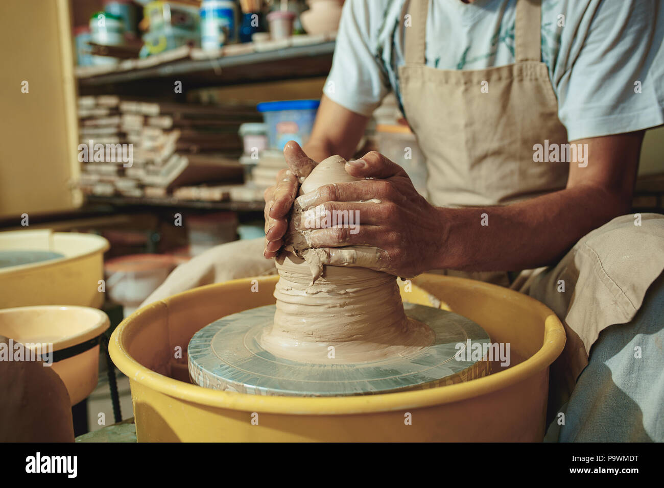 Creating a jar or vase of white clay close-up. Master crock Stock Photo ...