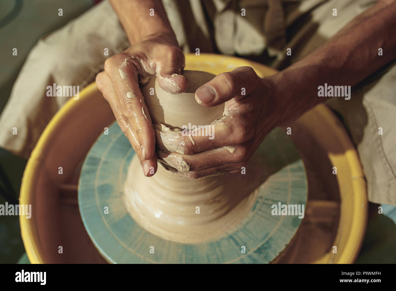 Creating a jar or vase of white clay close-up. Master crock Stock Photo ...