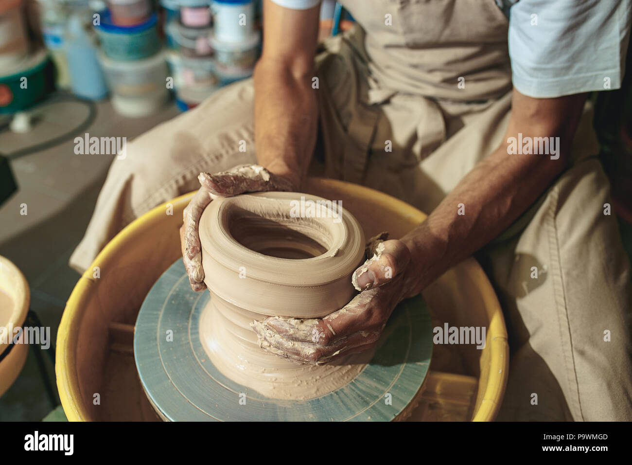 Creating a jar or vase of white clay close-up. Master crock Stock Photo ...