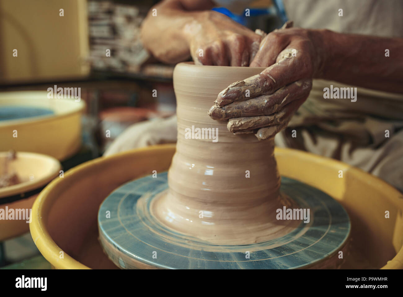 Creating a jar or vase of white clay close-up. Master crock Stock Photo ...