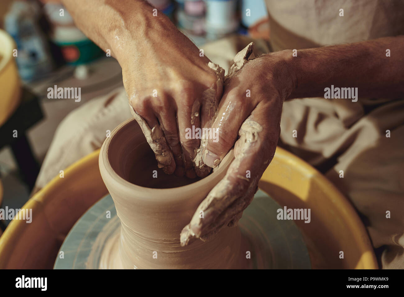 Creating a jar or vase of white clay close-up. Master crock Stock Photo ...